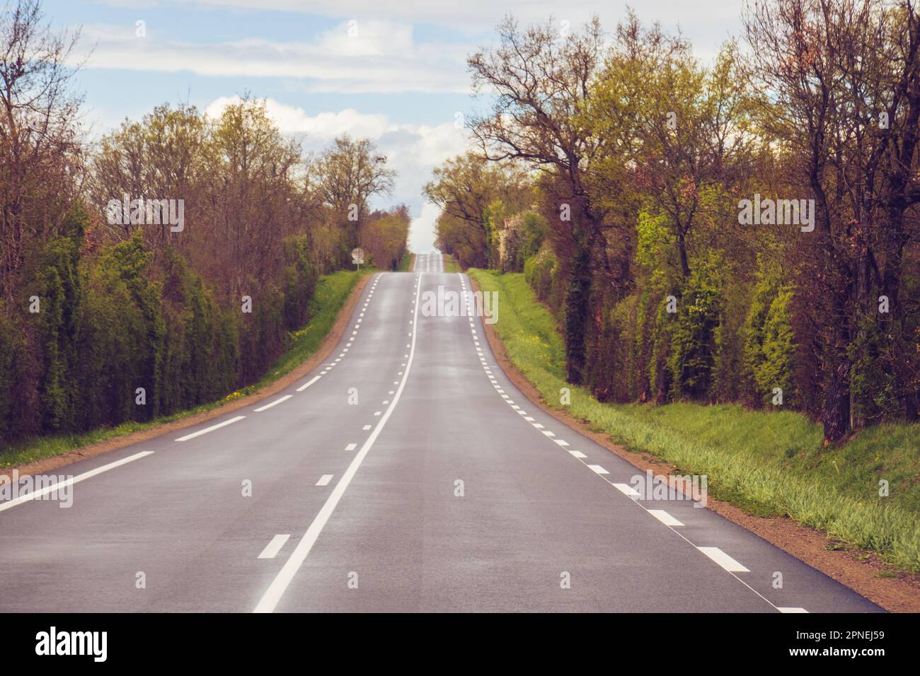 Traveling on a rural french country road in spring Stock Photo - Alamy