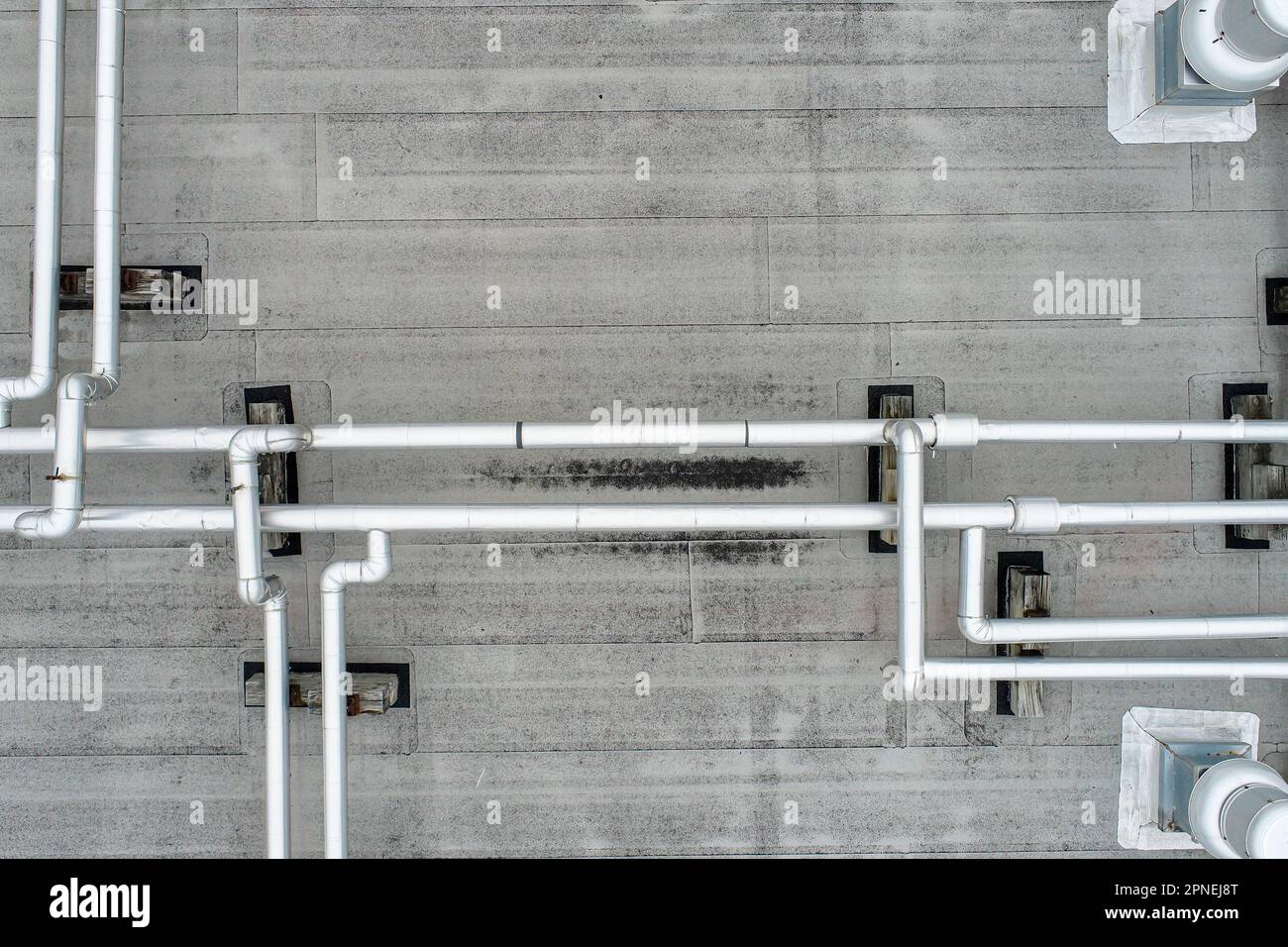 Aerial view of an Industrial looking HVAC equipment and pipes on gray ...