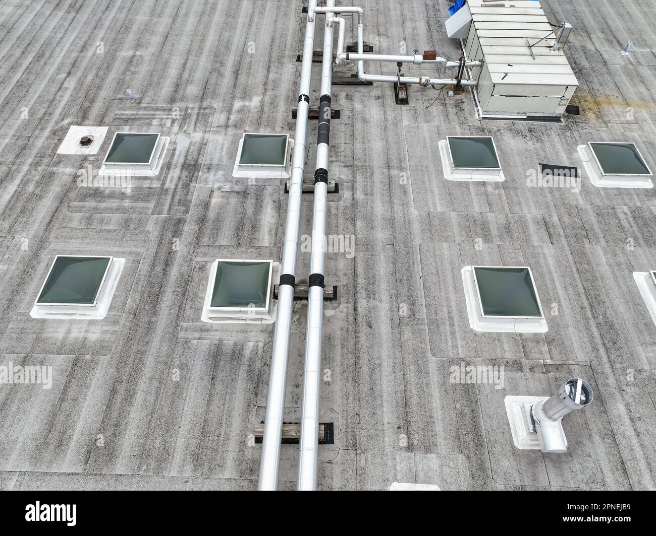 Aerial view of an Industrial looking HVAC equipment and pipes on gray ...