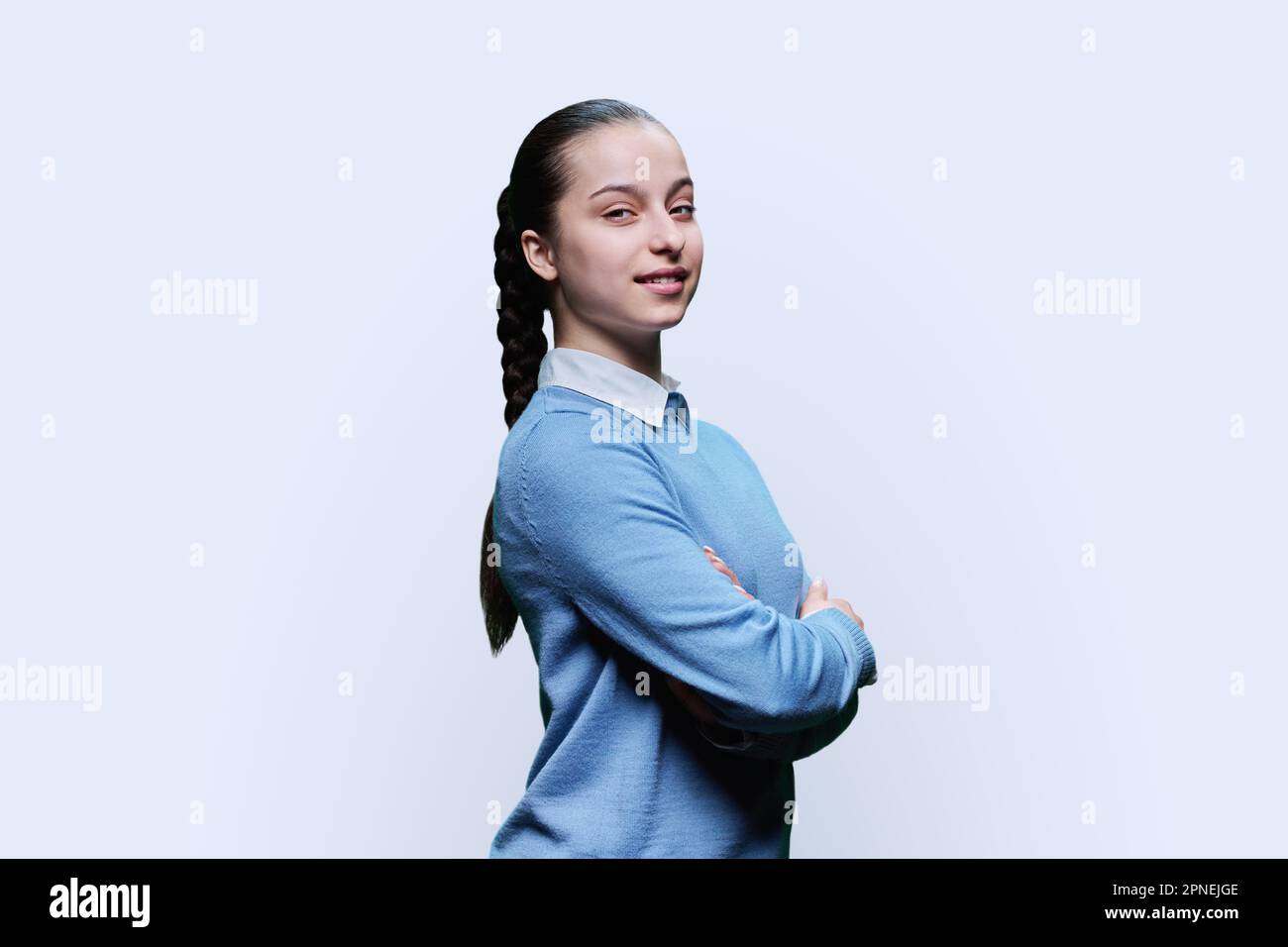 Portrait of smiling high school student girl on white background Stock ...