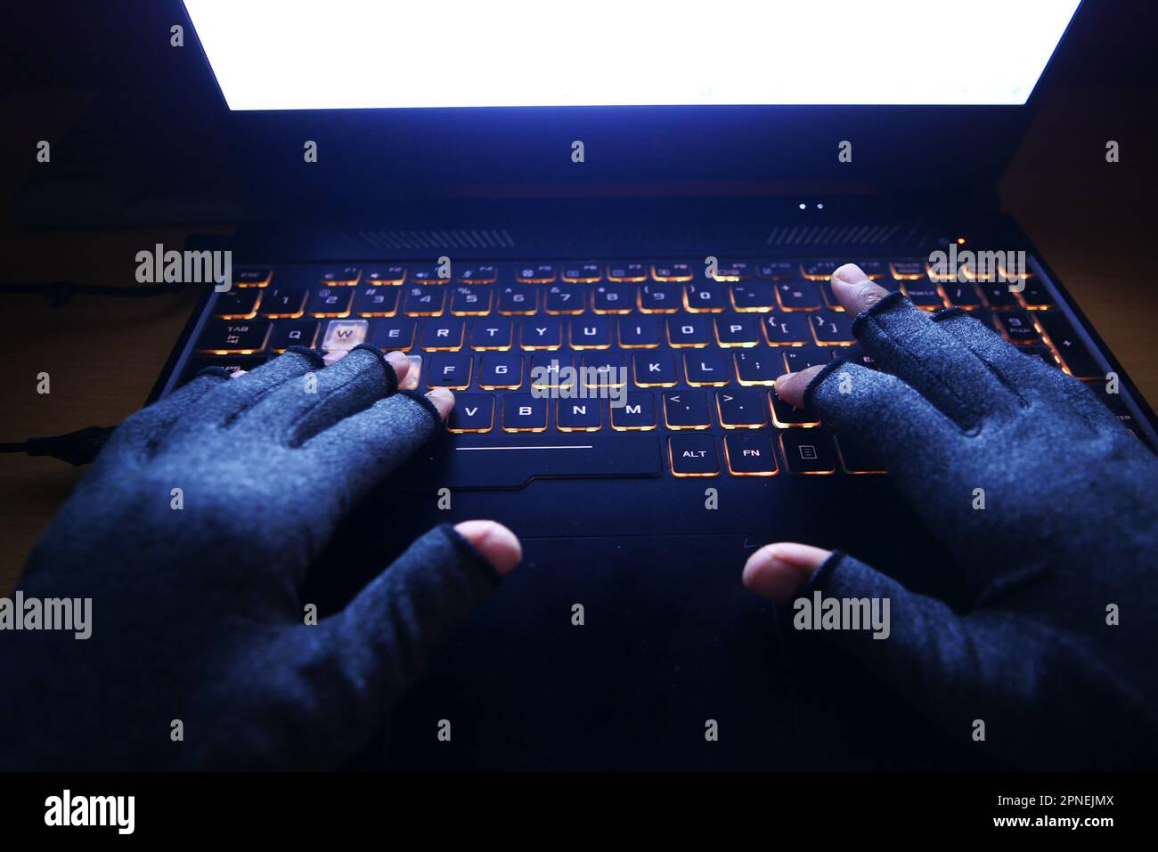 hacker hand stealing data from laptop top down Stock Photo - Alamy