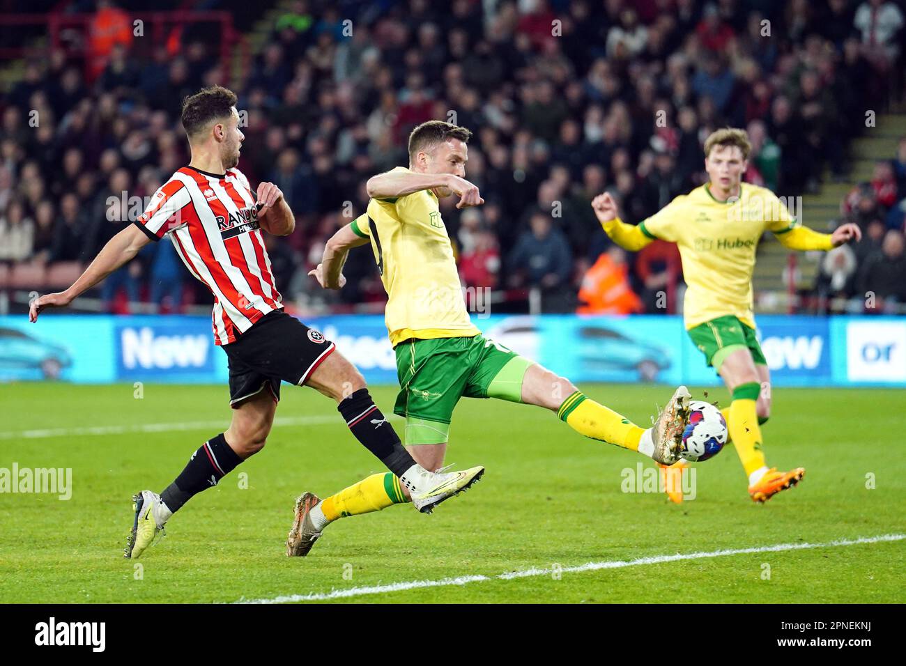 Bristol City's Andy King (centre) blocks the ball from Sheffield United ...