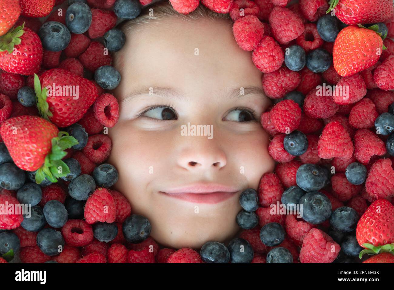 Berry banner. Kids face with close-up berry. Berries mix of strawberry ...