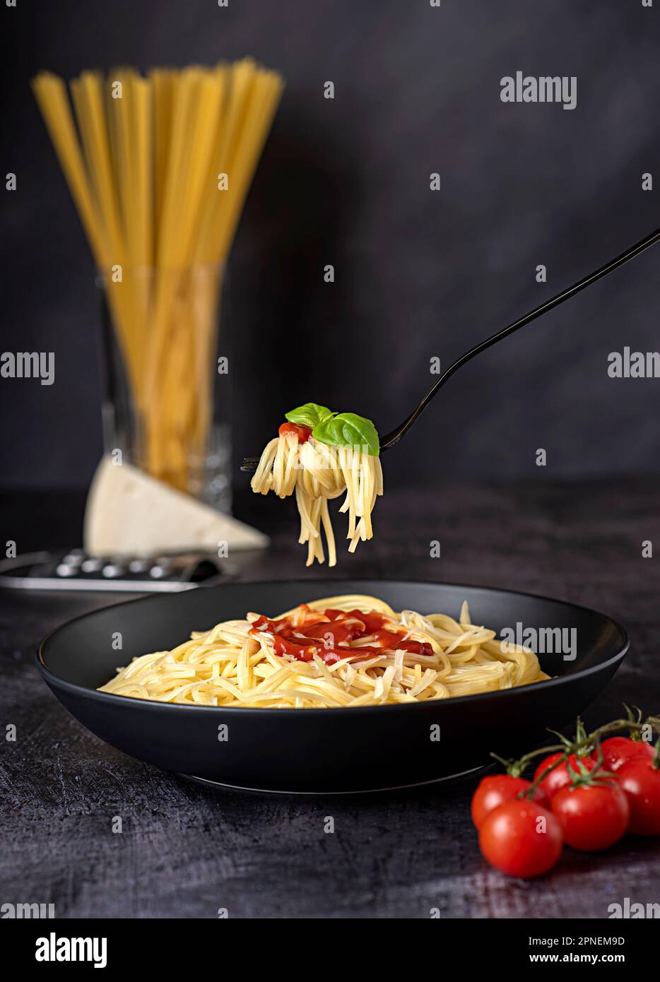 Food photography of spaghetti with tomato sauce, basil, cheese, topping ...