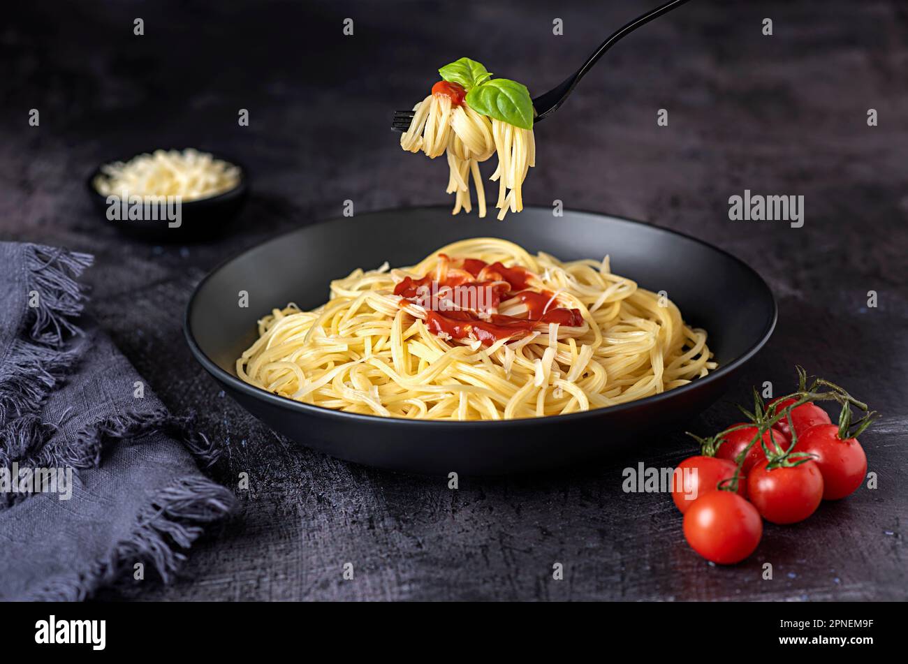 Food photography of spaghetti with tomato sauce, basil, cheese, topping ...