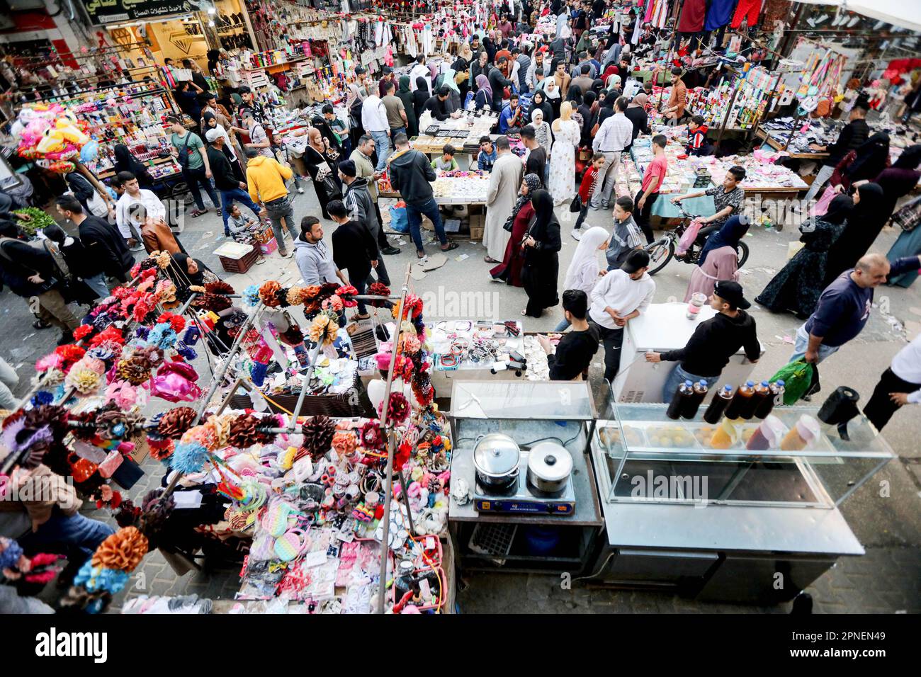 Palestinians make shopping in a local market in Khan Yunis, in the ...