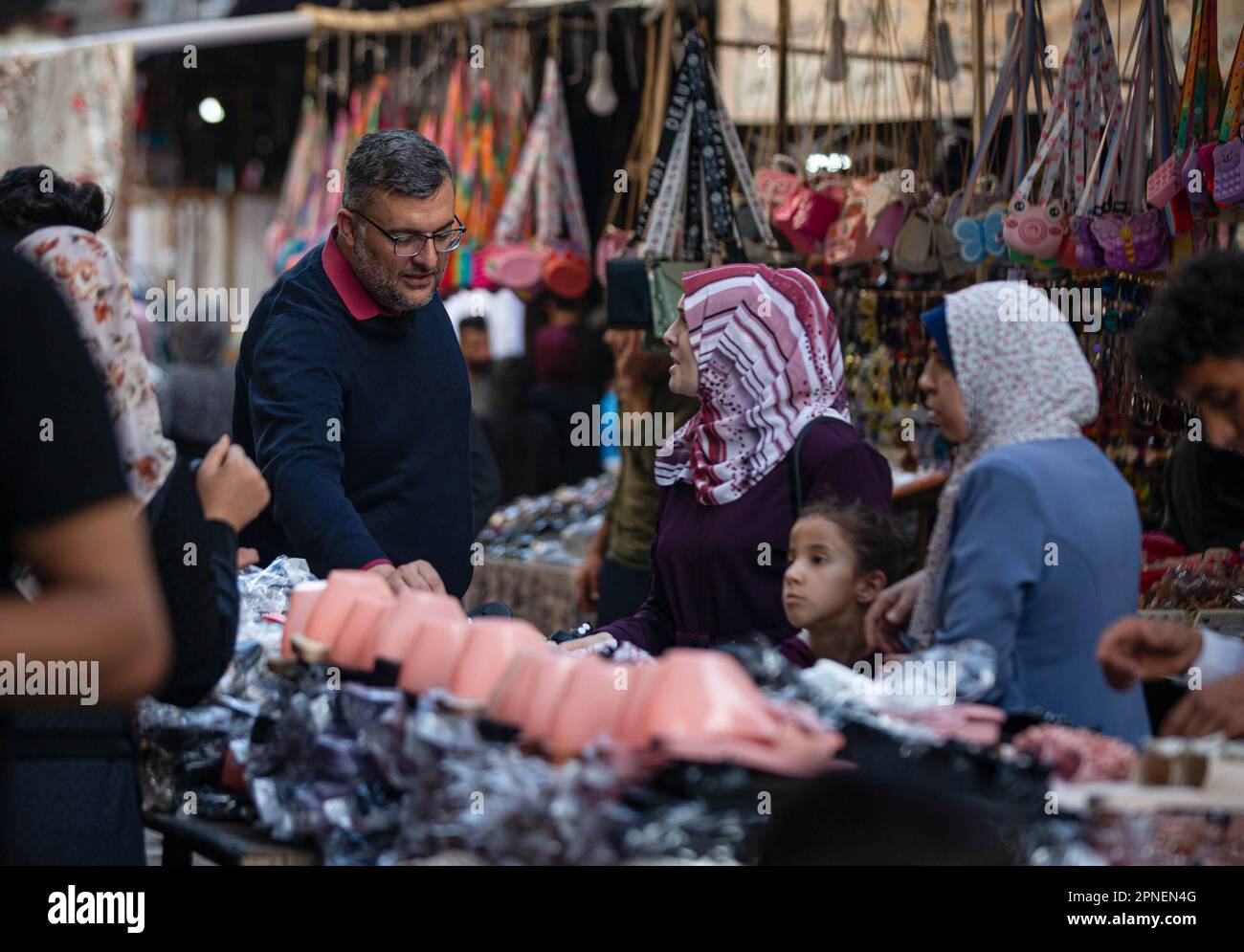 Palestinians make shopping in a local market in Khan Yunis, in the ...