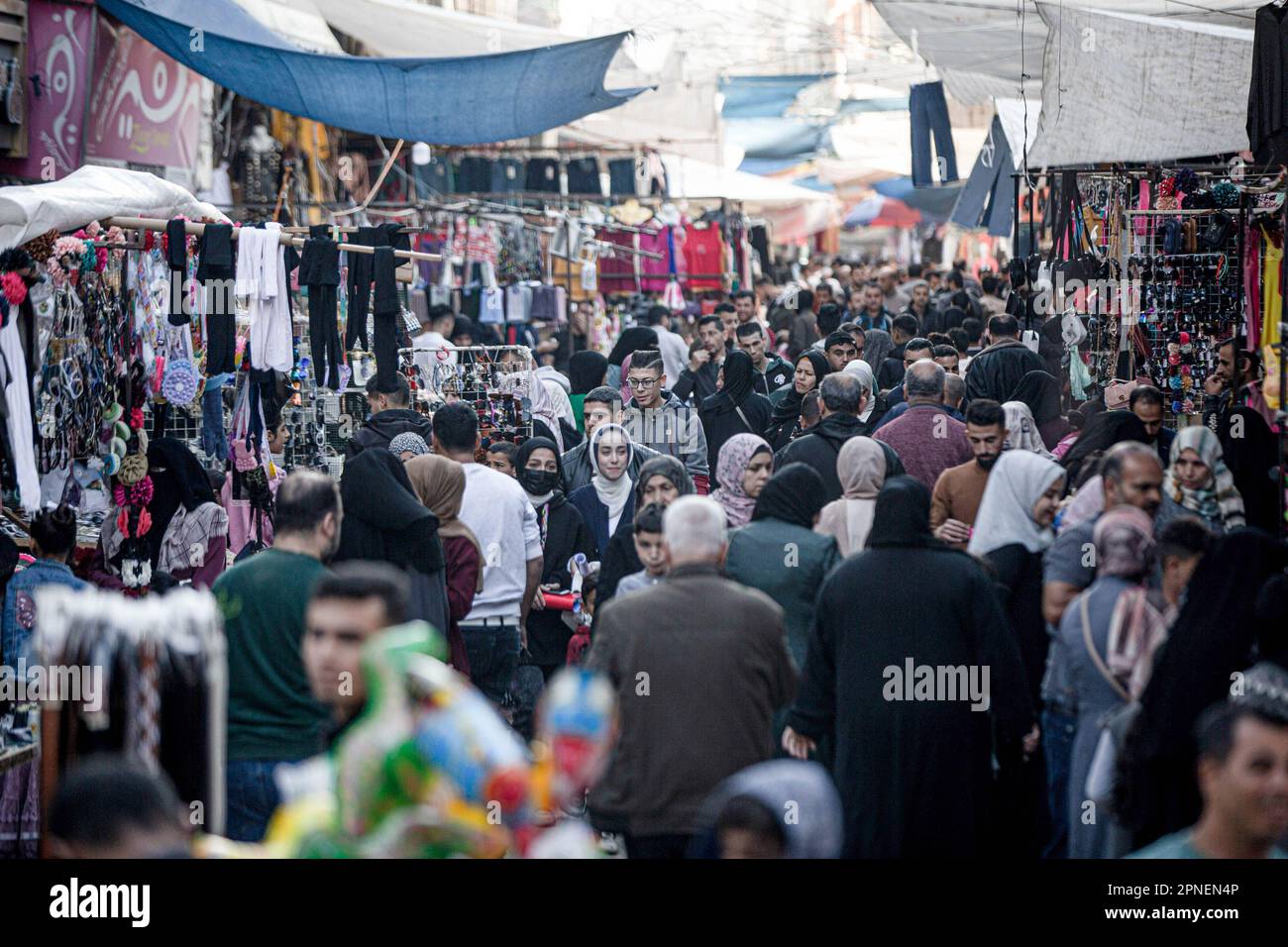 Palestinians make shopping in a local market in Khan Yunis, in the ...