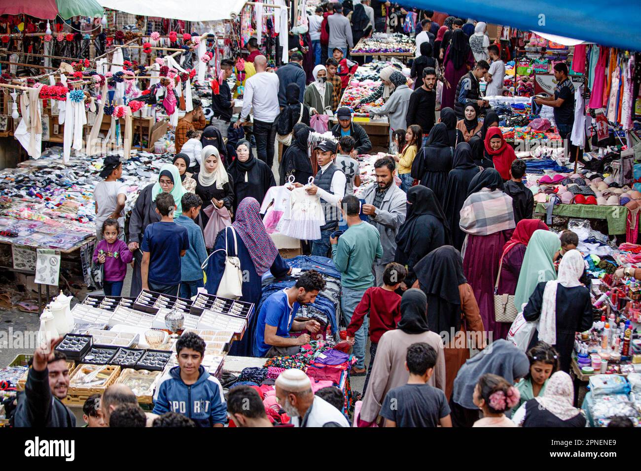 Gaza, Palestine. 18th Apr, 2023. Palestinians make shopping in a local ...