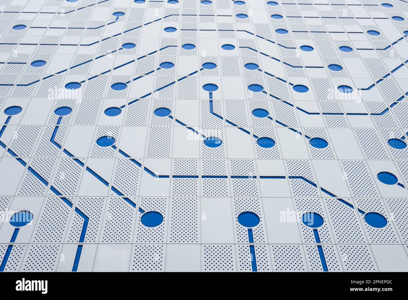 A gray building exterior featuring a blue network connection pattern ...