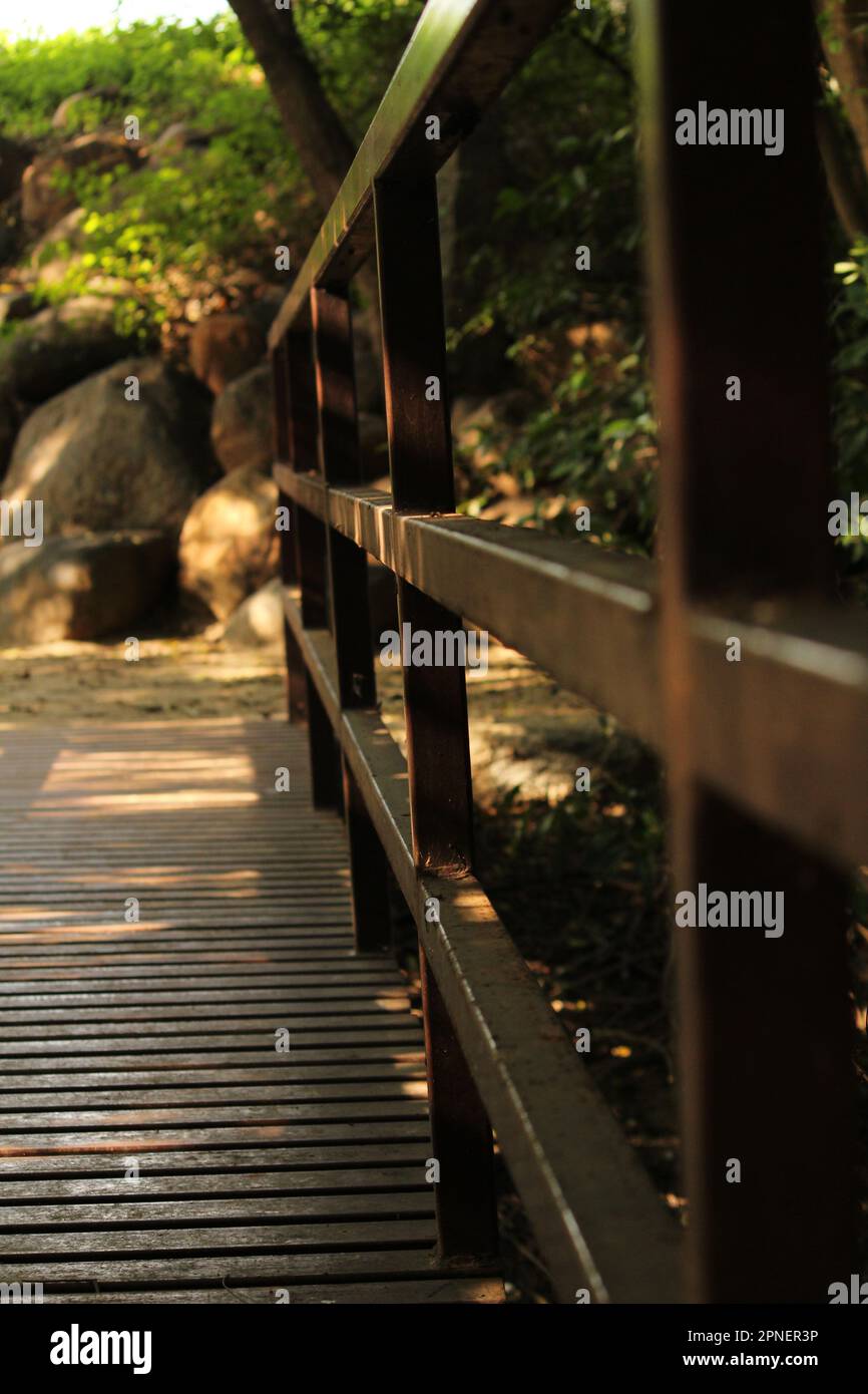 Steel or iron bridge on the garden with sunlight shadow. steel or iron ...
