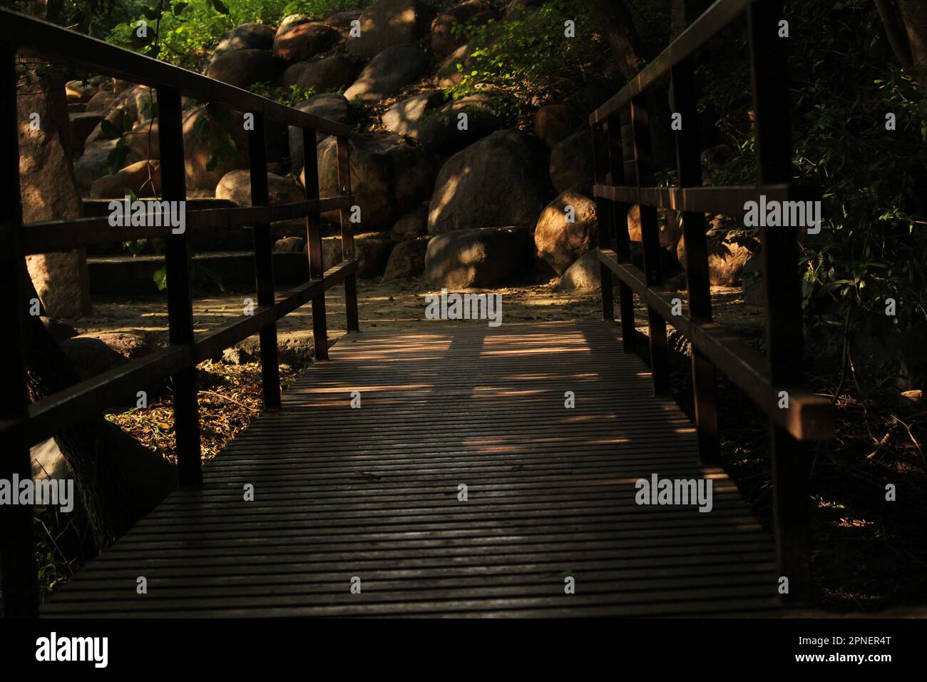 Steel or iron bridge on the garden with sunlight shadow. steel or iron ...
