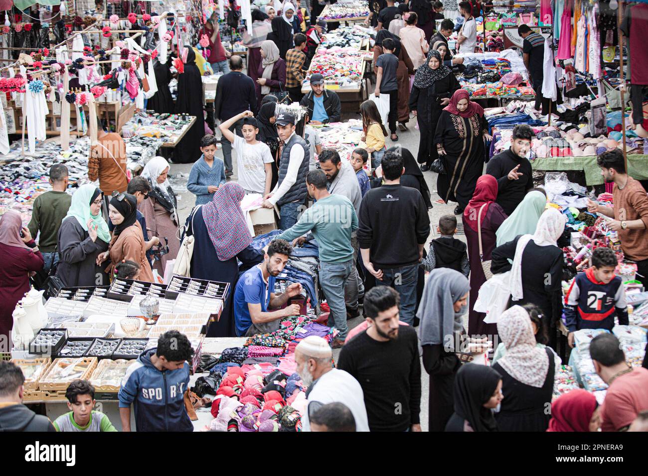 Gaza, Palestine. 18th Apr, 2023. Palestinians make shopping in a local ...