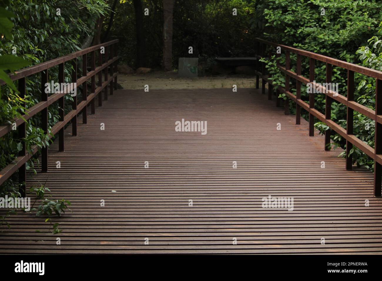 Steel or iron bridge on the garden with sunlight shadow. steel or iron ...