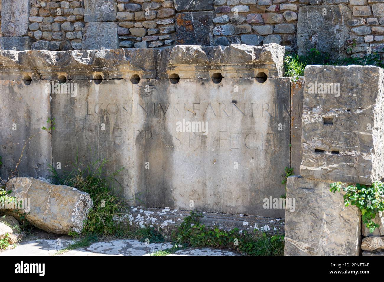 Stone with an inscription in Latin script in the ancient city of Cuicul ...