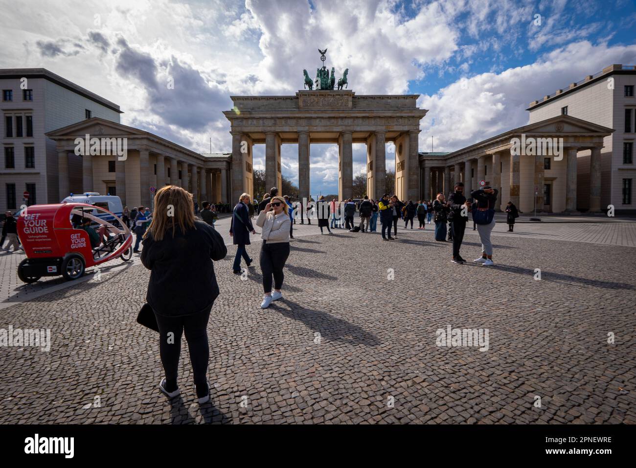 Tourists take pictures at The Brandenburg Gate an 18th-century ...