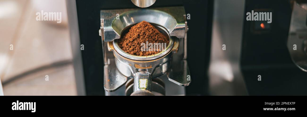 Process of grinding coffee beans pouring into a portafilter using ...