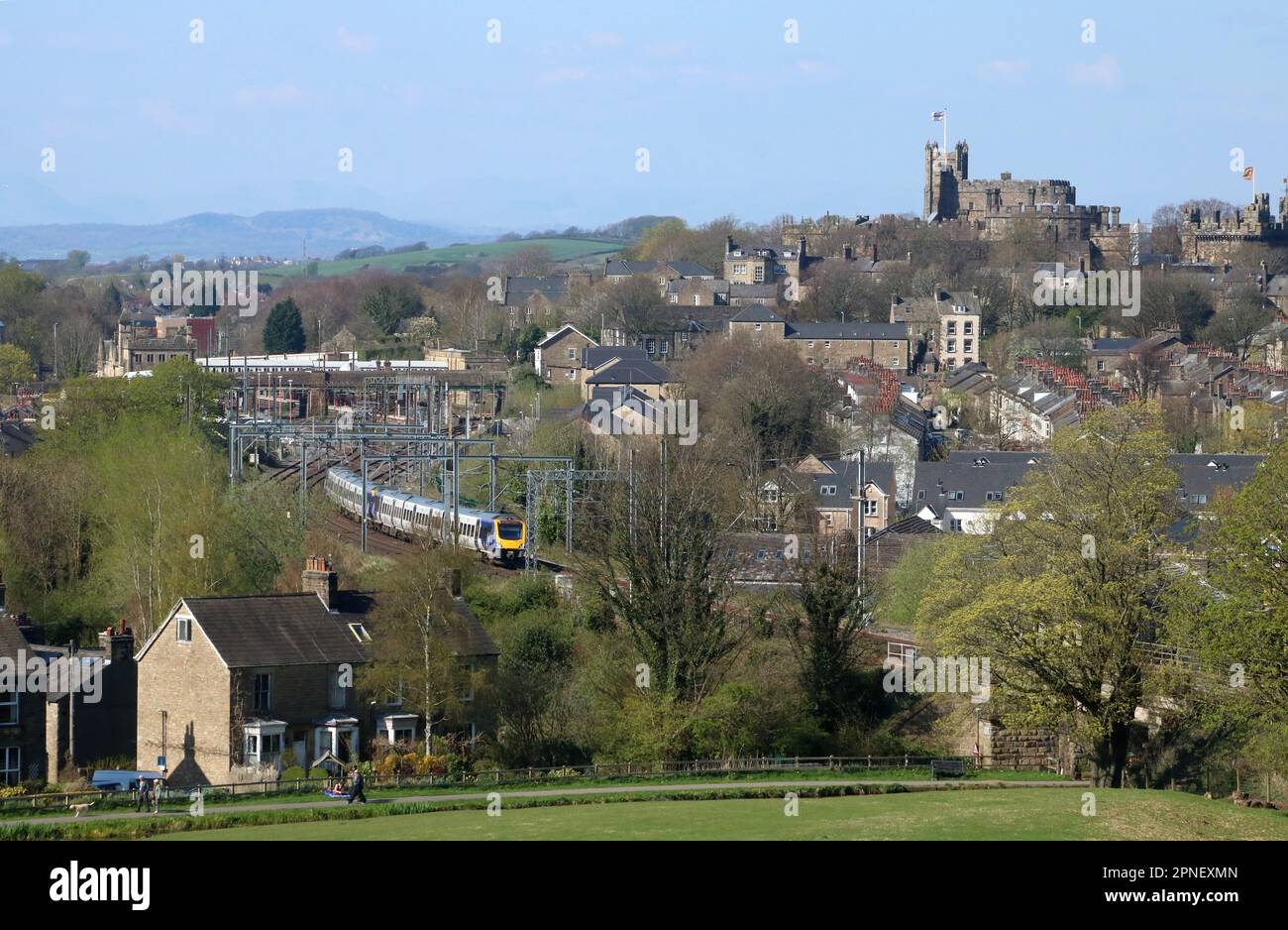 View to Lancaster Castle and Priory Church with Northern trains Civity ...