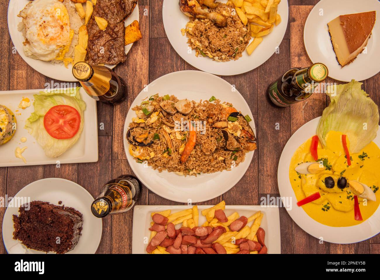 A set of Peruvian food dishes with papas a la huancaina in the center ...