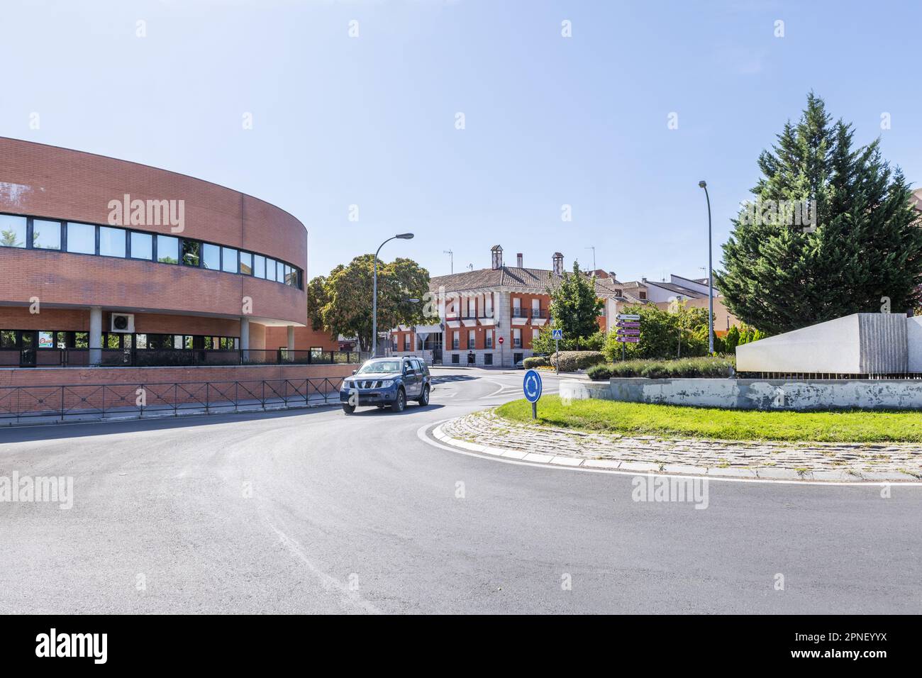 Facade of the government building in a square of a small town with road ...