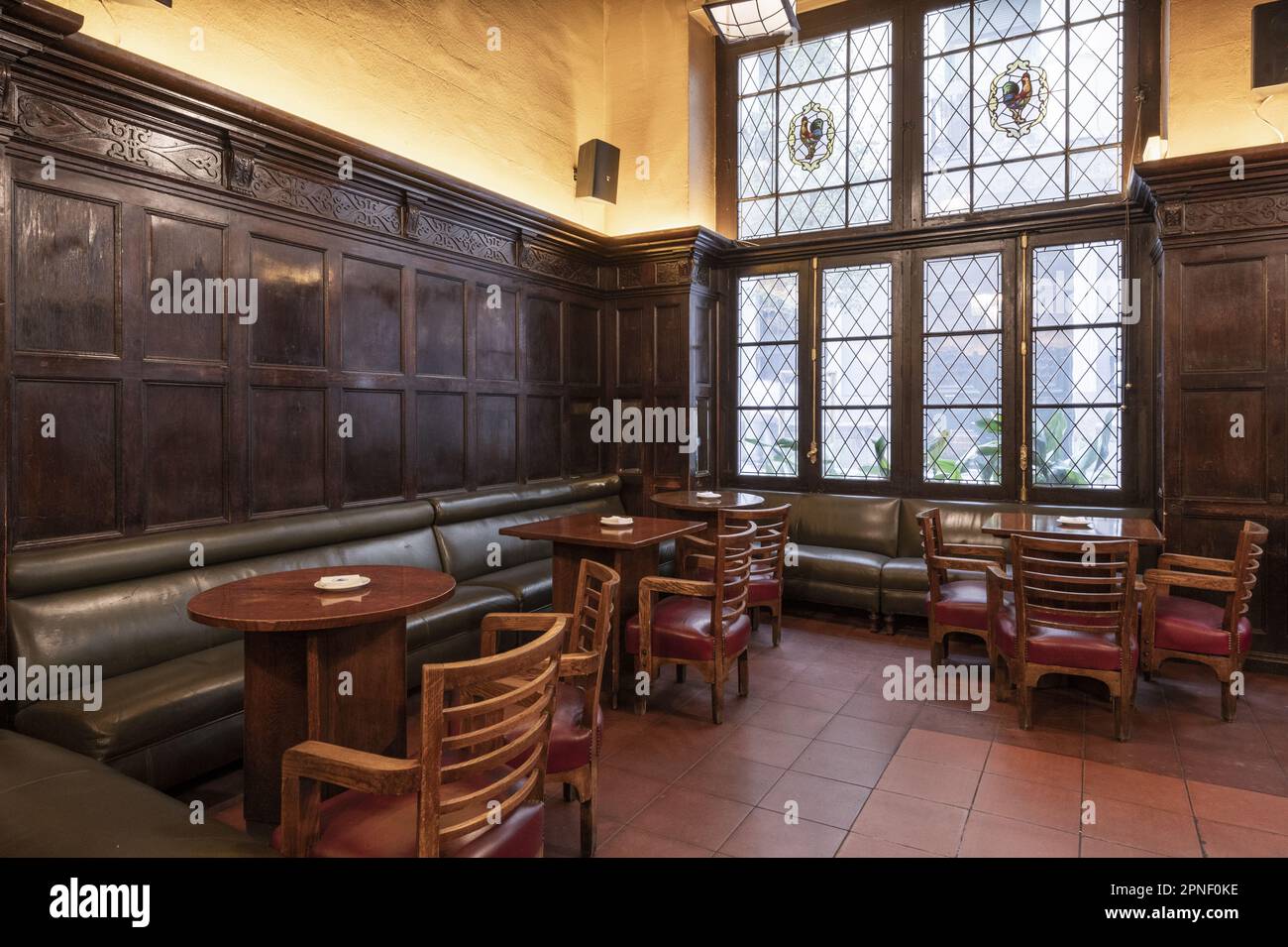 An old British style pub cafe lounge with paneled walls Stock Photo - Alamy