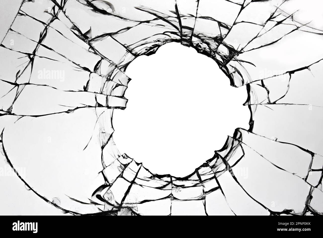 Cracked broken glass on a white background. Damaged window texture with ...