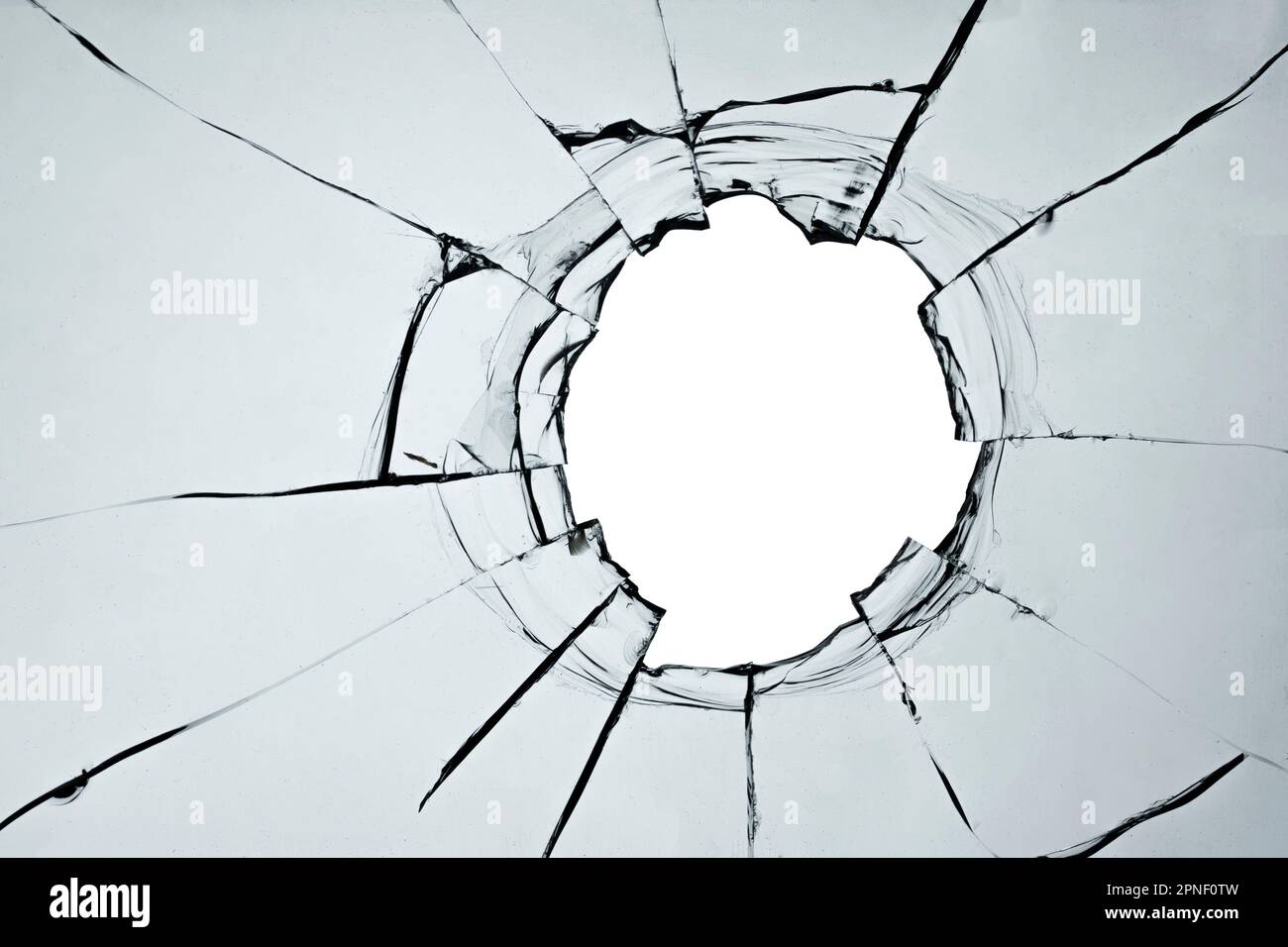 Broken window, background of cracked glass with a hole from a shot or ...