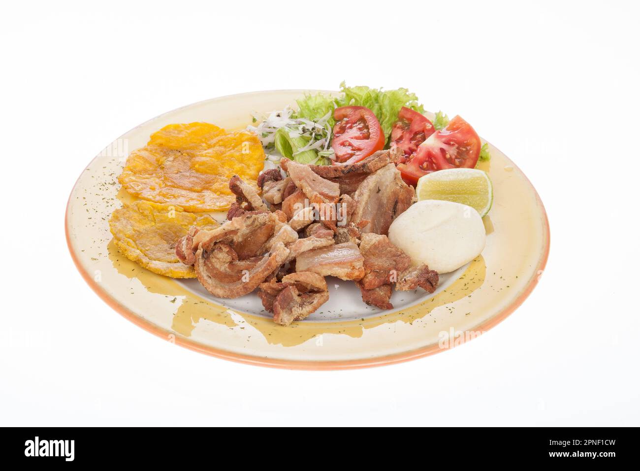Colombian Food, Fried Chicharron Accompanied By Salad, Patacon, And ...