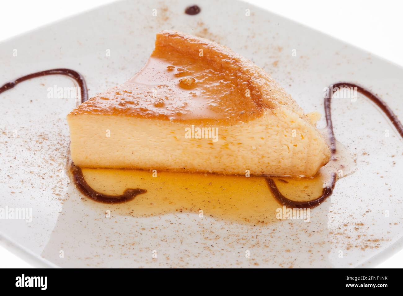 Tasty Dessert Portion Of Cheesecake Served With Caramel Stock Photo - Alamy