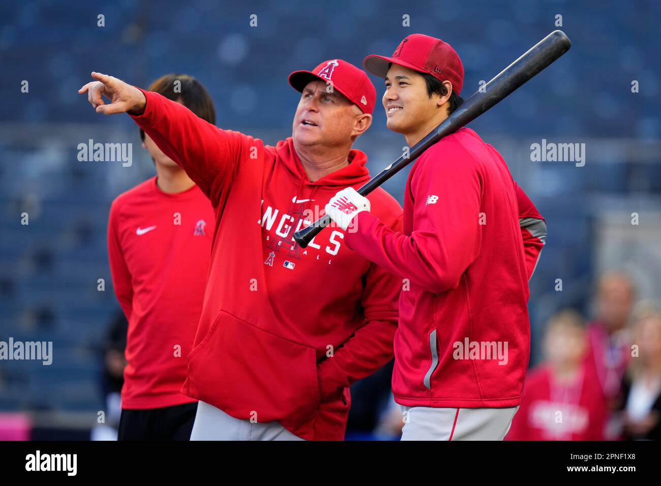 Los Angeles Angels manager Phil Nevin talks to Shohei Ohtani, of Japan ...