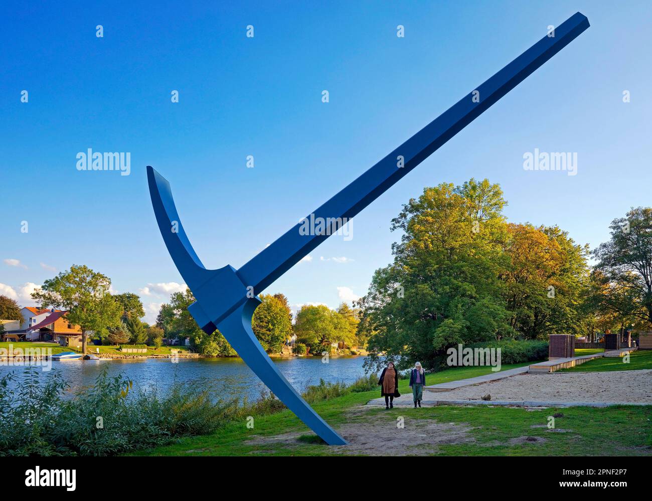 Hiroshima bank on the river Fulda with metal sculpture Pickaxe, Germany ...
