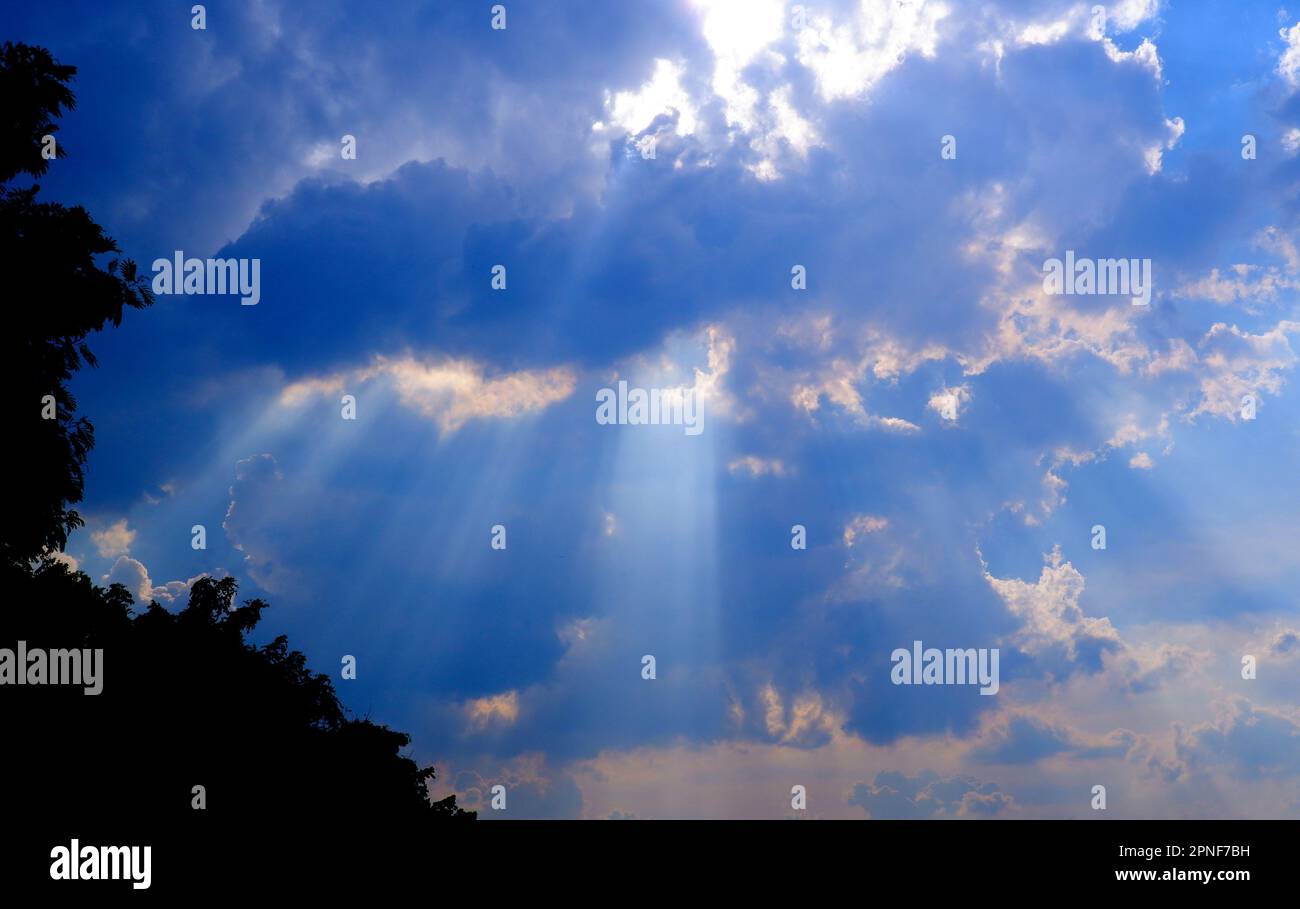 sun ray light through cloud on blue sky : can be used as background and ...