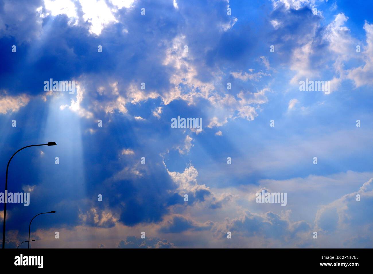 sun ray light through cloud on blue sky : can be used as background and ...