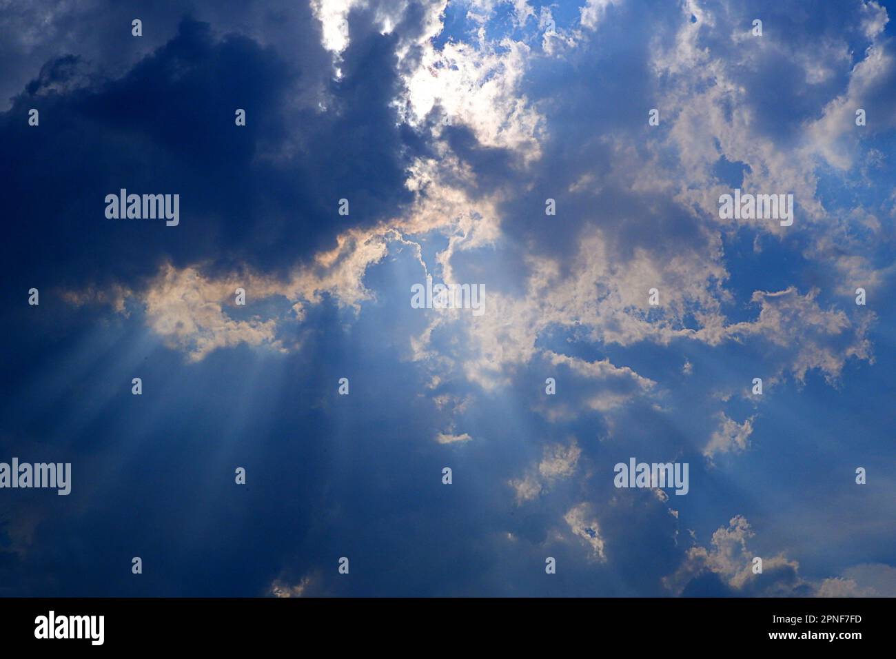 sun ray light through cloud on blue sky : can be used as background and ...