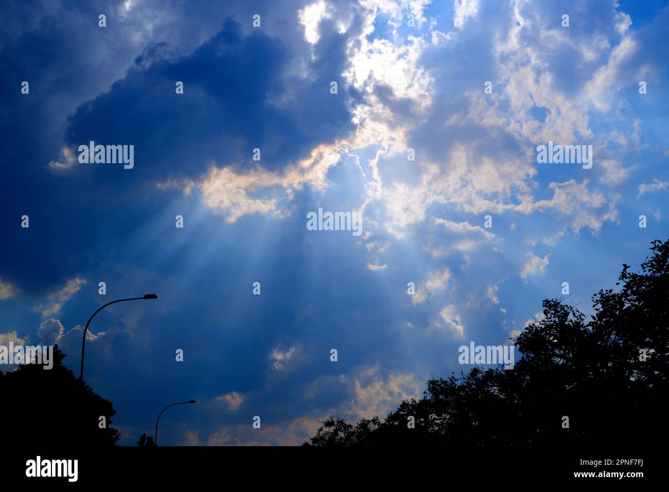 sun ray light through cloud on blue sky : can be used as background and ...