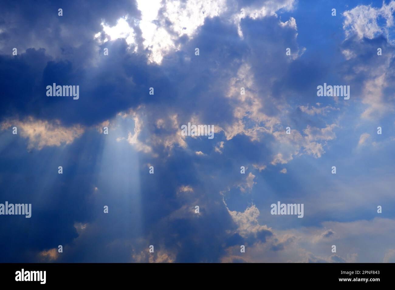 Defocused Sun Ray Light Through Cloud on Blue Sky : can be used as ...