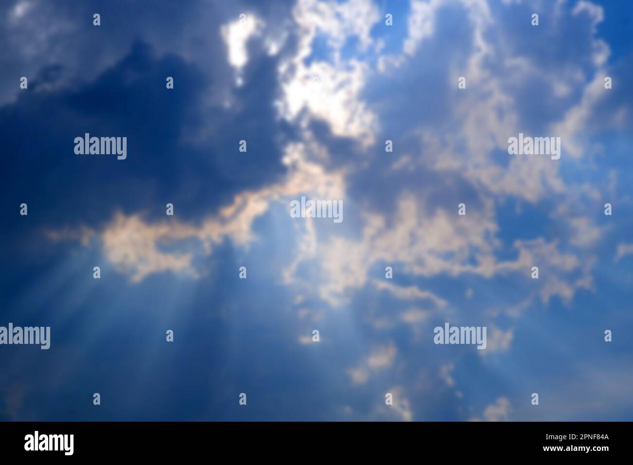 Defocused Sun Ray Light Through Cloud on Blue Sky : can be used as ...