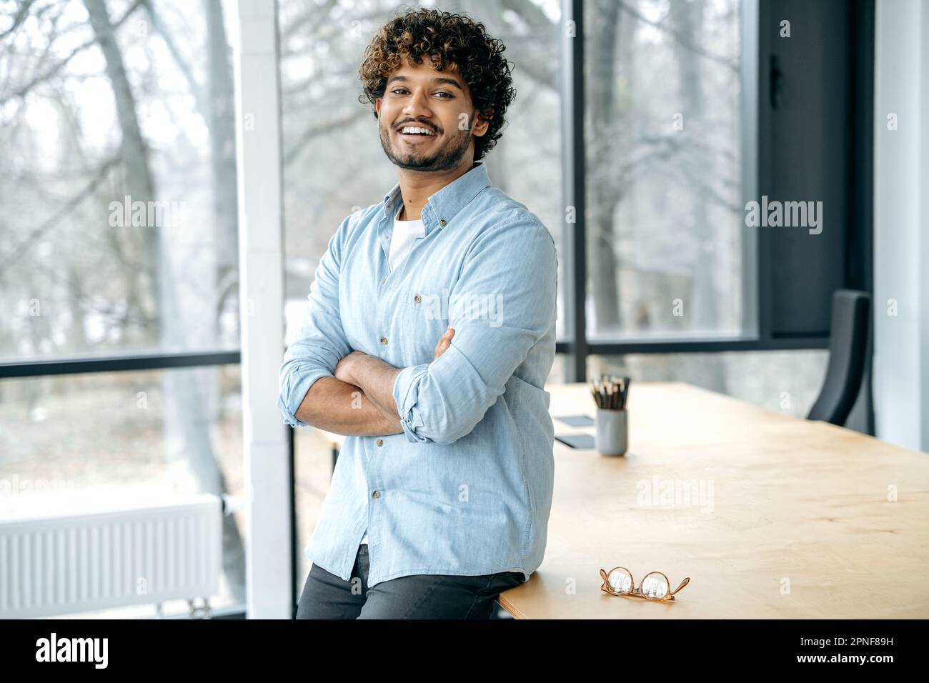 Indian male programmer standing hi-res stock photography and images - Alamy