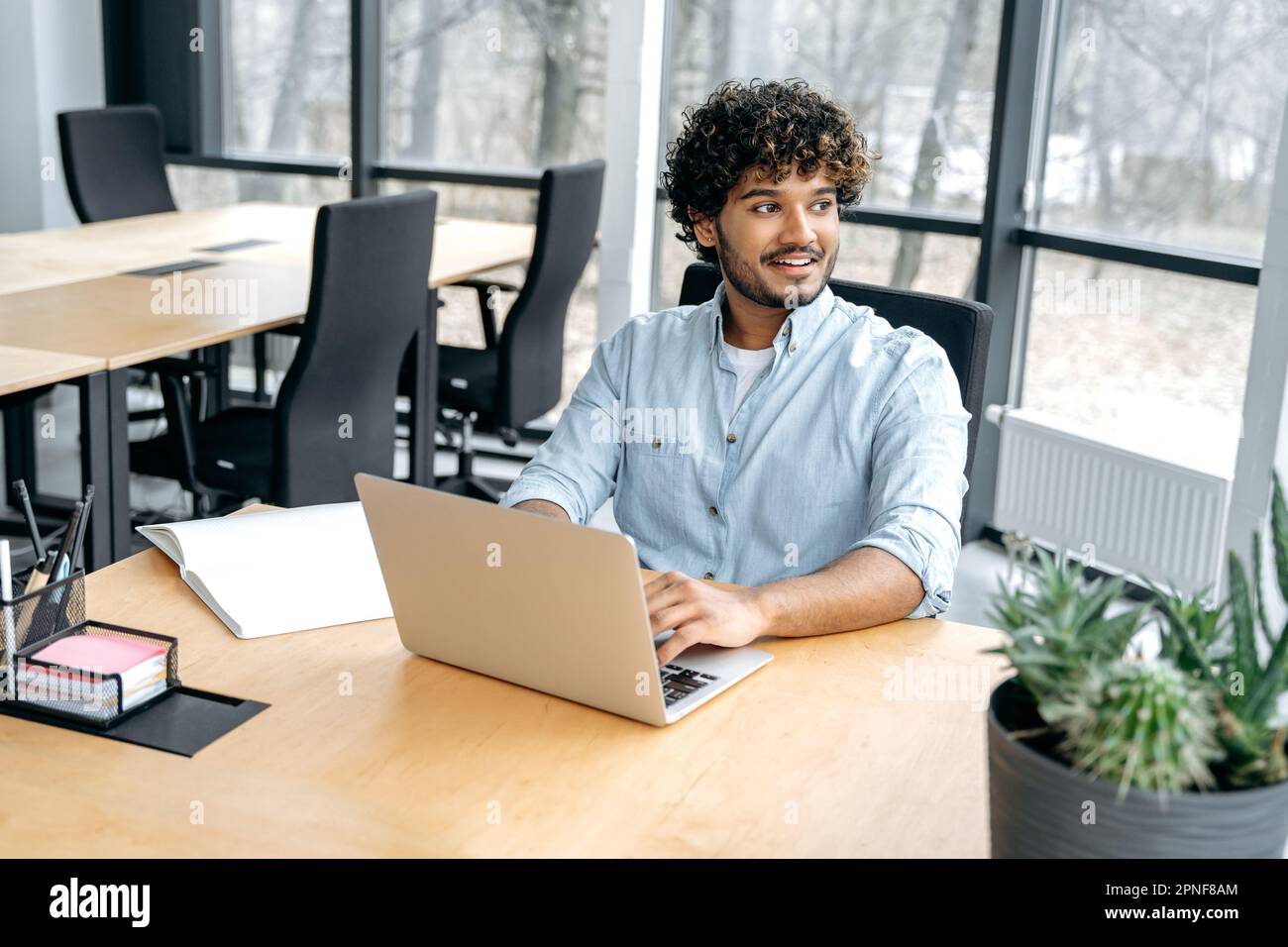 Confident positive successful indian or arabian man with curly hair, in ...