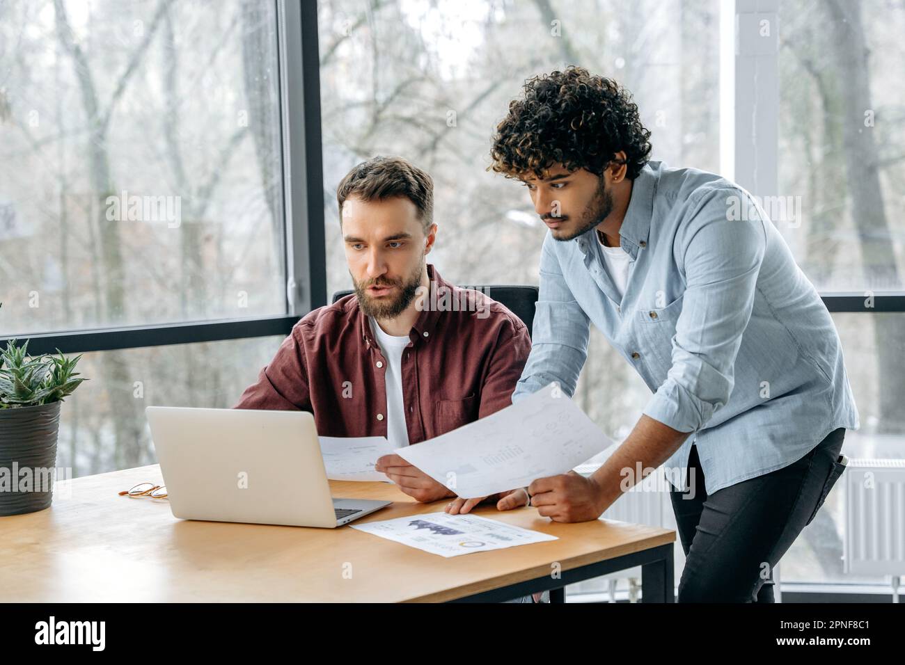 Collaboration concept. Focused successful multiracial male ...