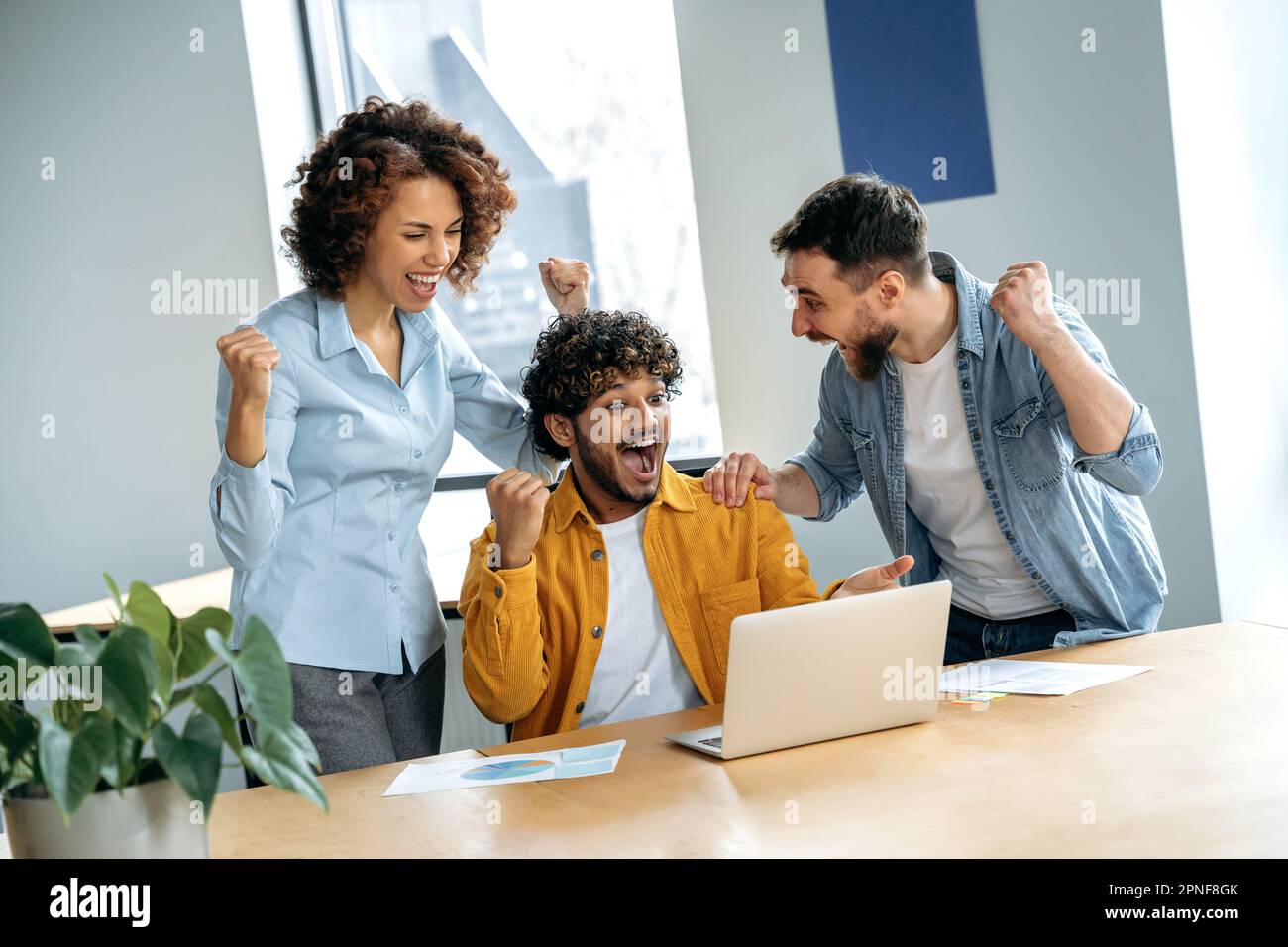 Success, win. Successful people of different nationalities, creative business team, working ...