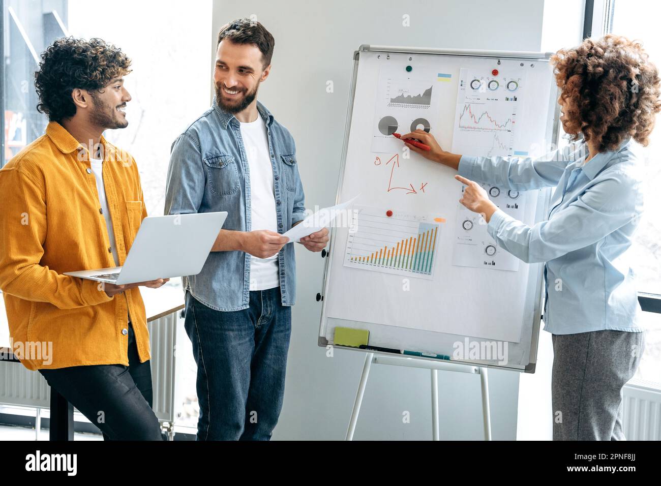 Creative team working together. Group of a positive multiracial ...