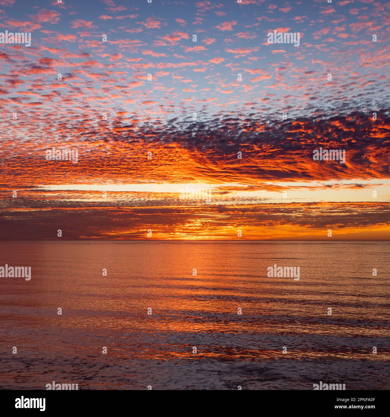 United States, California, Big Sur, Cirrus clouds over ocean at sunset ...