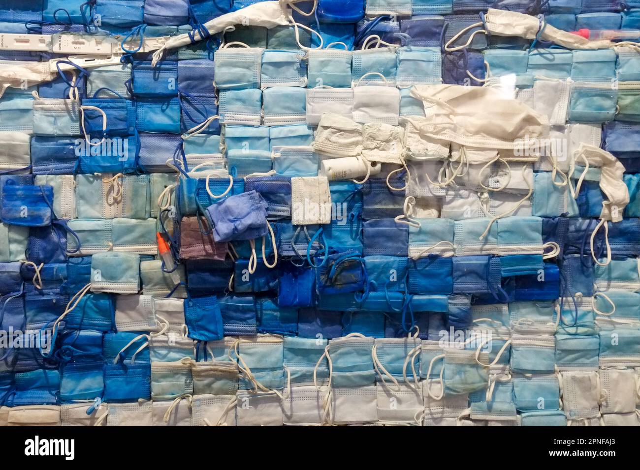 Wall of recycled face masks Stock Photo - Alamy