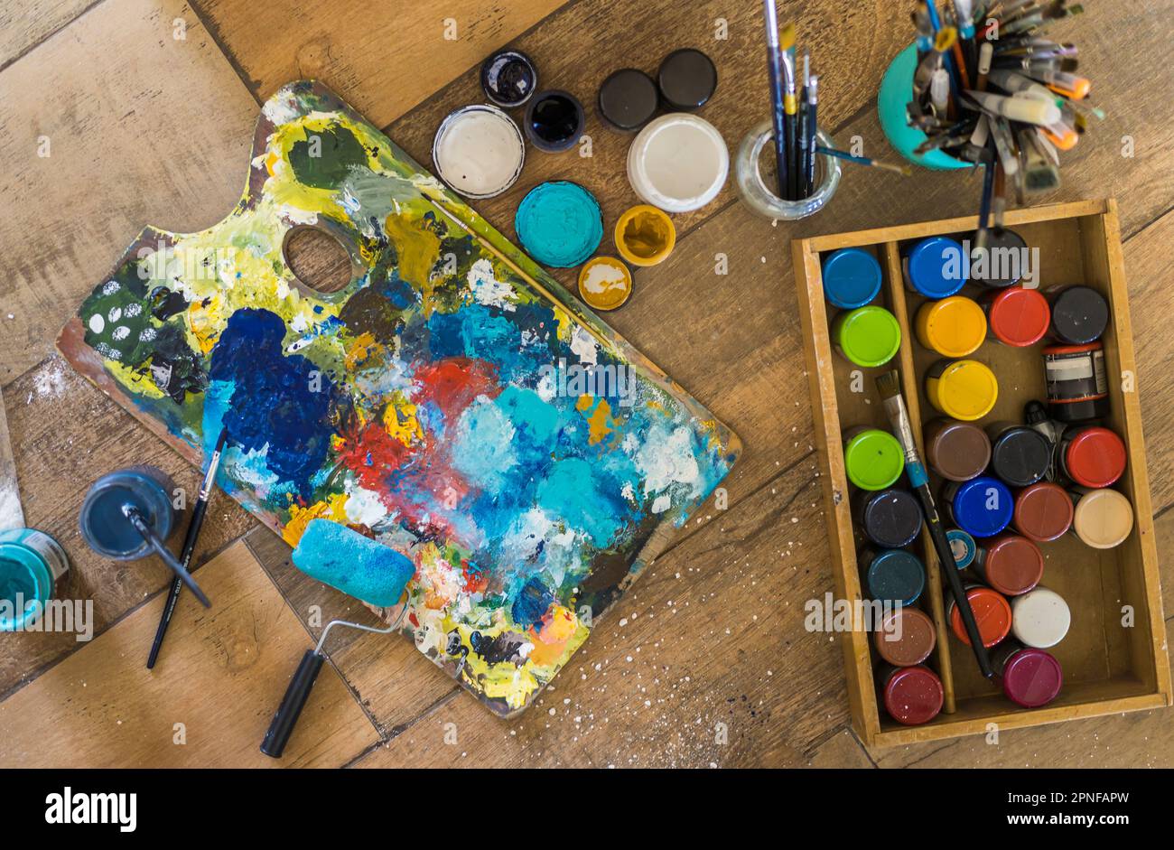 High angle view of brushes, pallete, oils, acrylics and other elements ...