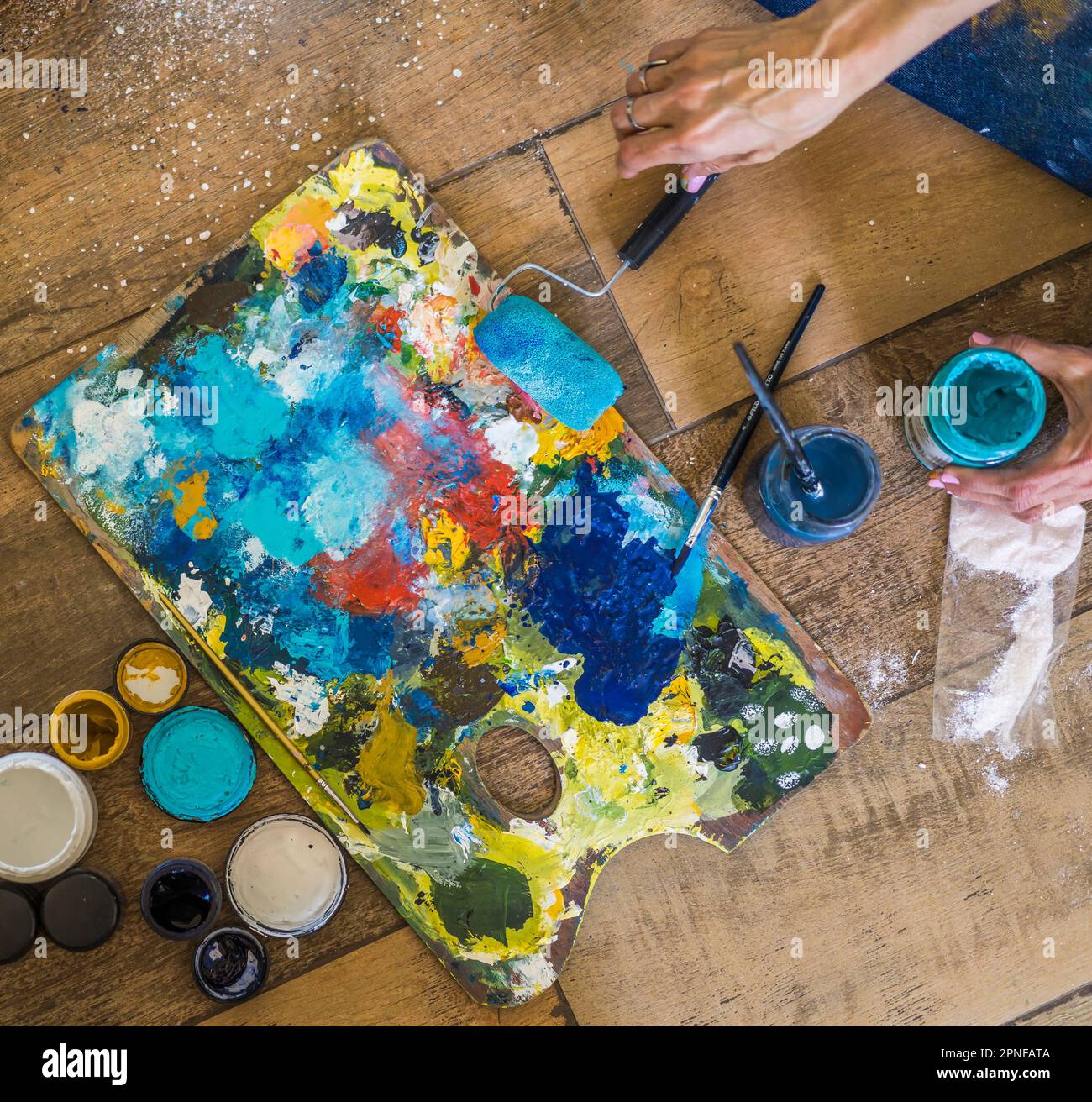 High angle view of brushes, pallete, oils, acrylics and other elements ...