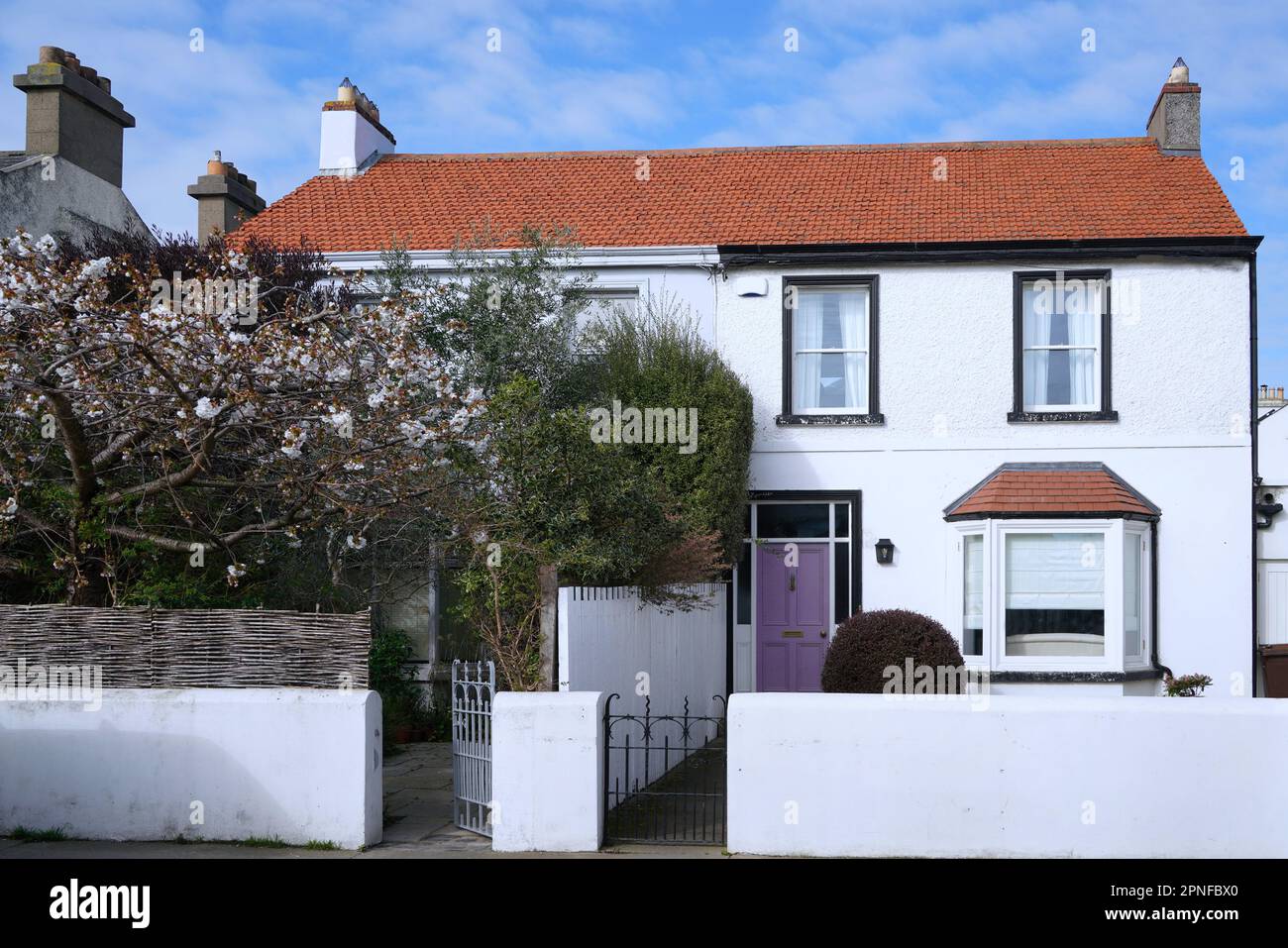 White stucco semi-detached houses with tile roof Stock Photo - Alamy