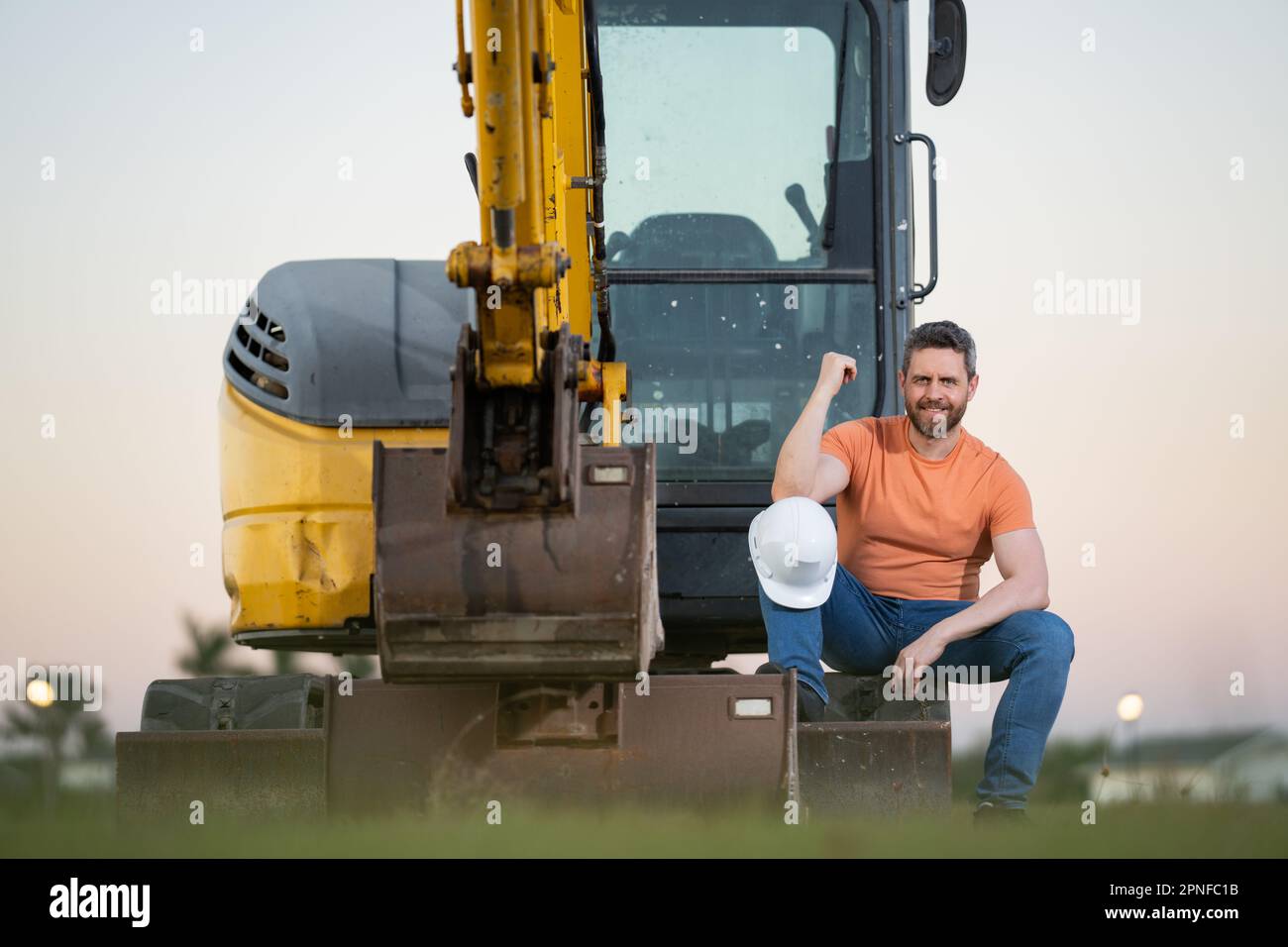 Worker with bulldozer on site construction. Man excavator worker ...