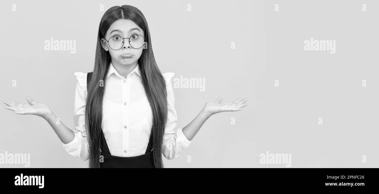 confused child in school uniform and glasses for vision protection ...