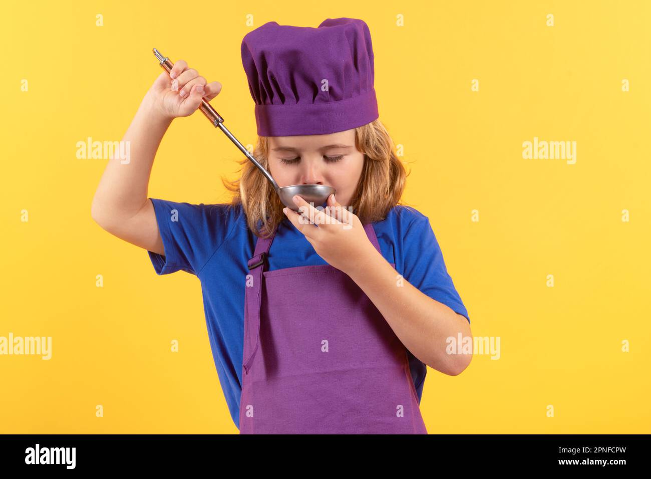 Funny kid chef cook with kitchen ladle, studio portrait. Child cooking ...